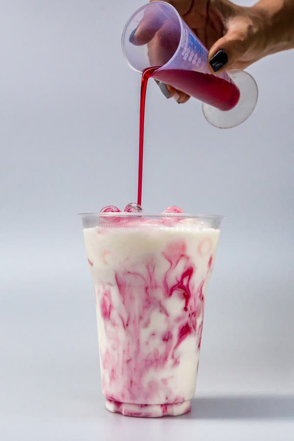 Thai Style Cold Drink in Plastic Glass. Hand Pouring Ingredient into ...