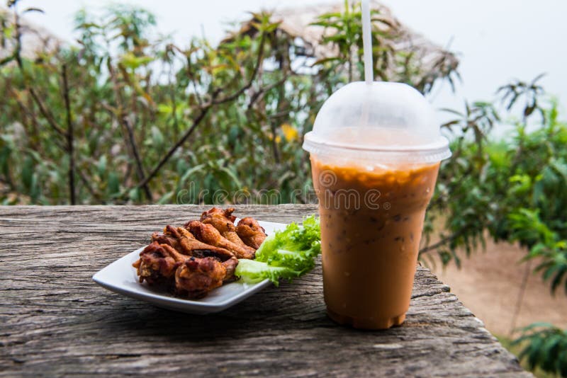 Thai Style Fried Chicken with Iced Milk Tea Stock Image - Image of ...