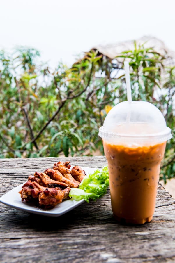 Thai Style Fried Chicken with Iced Milk Tea Stock Image - Image of ...
