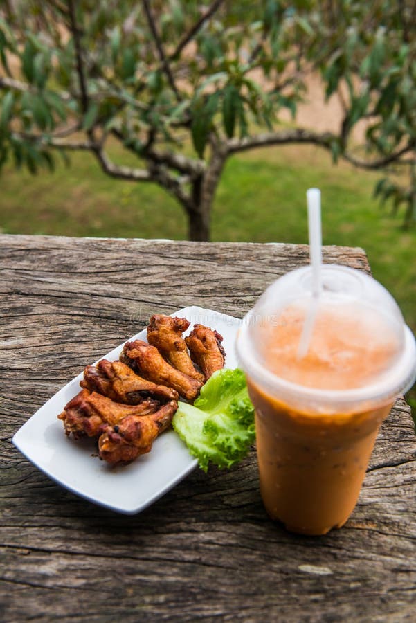 Thai Style Fried Chicken with Iced Milk Tea Stock Photo - Image of thai ...