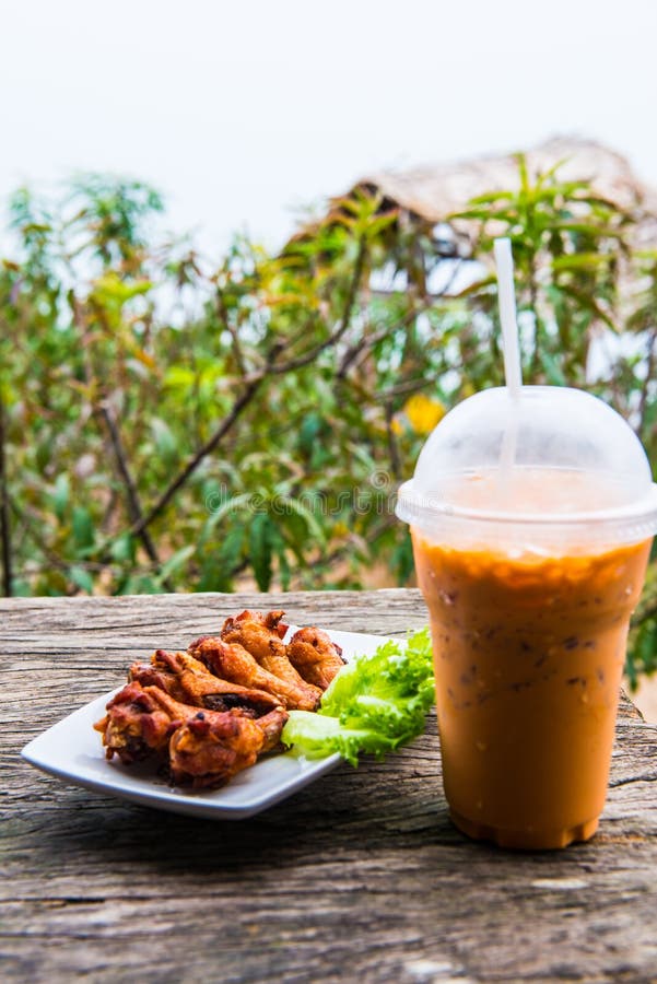 Thai Style Fried Chicken with Iced Milk Tea Stock Image - Image of ...