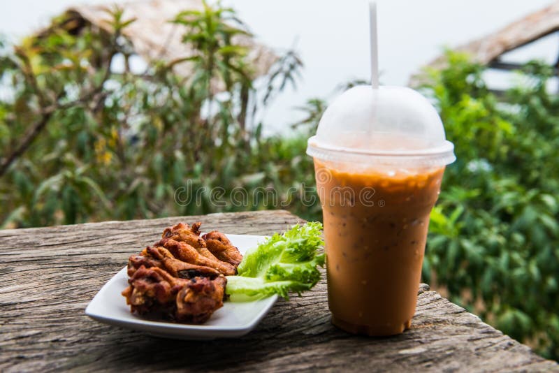 Thai Style Fried Chicken with Iced Milk Tea Stock Photo - Image of ...