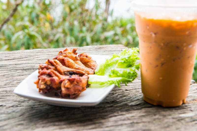 Thai Style Fried Chicken with Iced Milk Tea Stock Image - Image of ...
