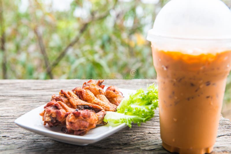 Thai Style Fried Chicken with Iced Milk Tea Stock Image - Image of ...