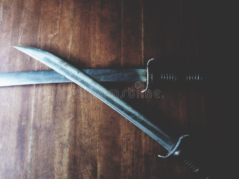 Thai sword on wooden table stock photo. Image of asian - 89740660