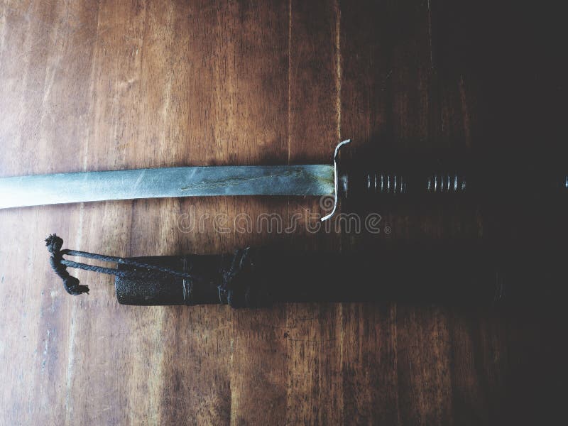 Thai sword on wooden table stock photo. Image of equipment - 89740684