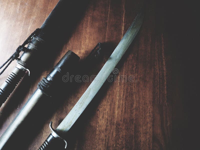 Thai sword on wooden table stock image. Image of traditional - 89740709