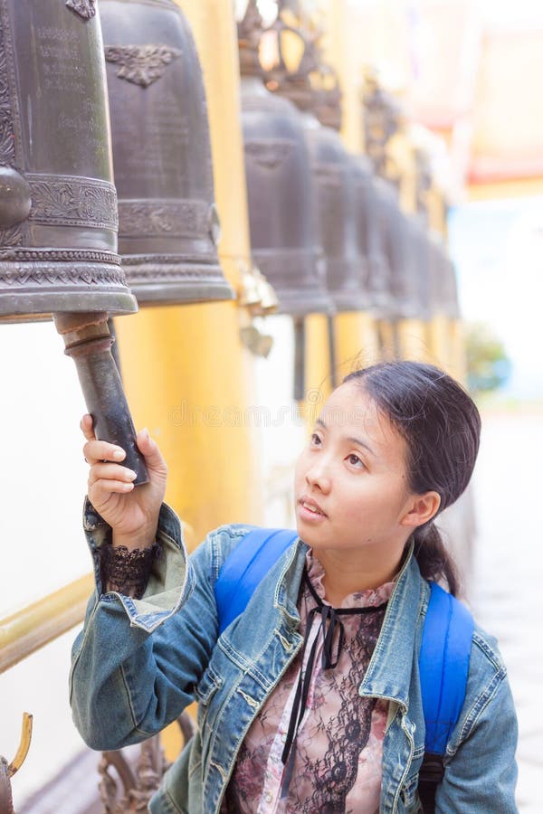 Thai woman hit the bell stock image. Image of temple - 32319101