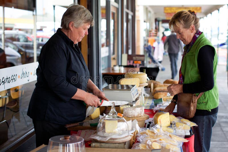 THAMES - AUGUST 17: Customer Buying Cheese on Thames Market Day ...