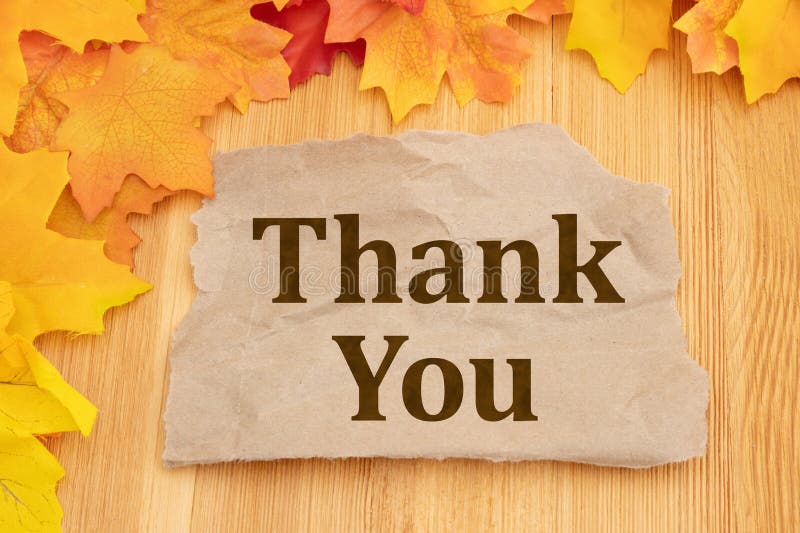 Thank You Note with Fall Leaves with a Torn Piece of Paper on Wood ...