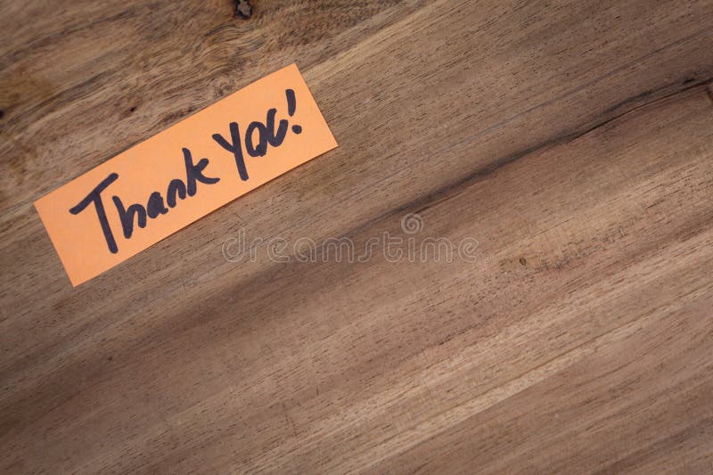 A Thank You Note on a Wooden Surface Stock Photo - Image of office ...