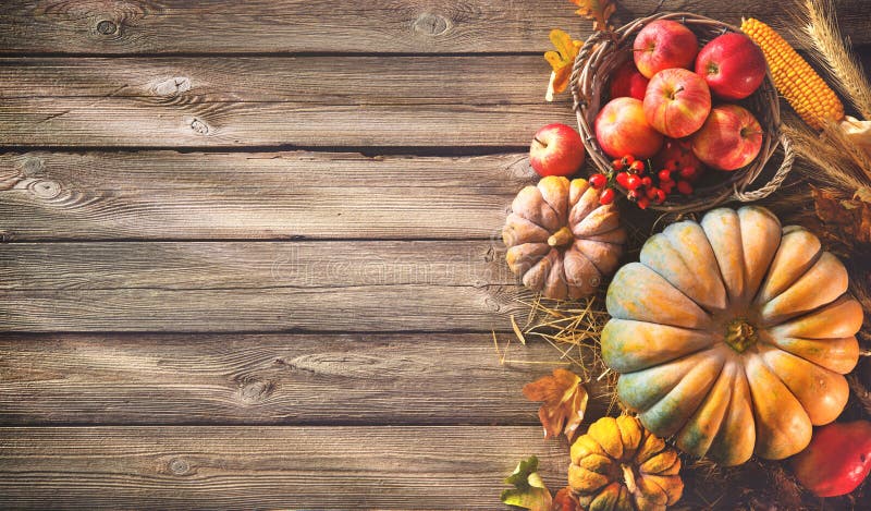 Thanksgiving Background with Pumpkins and Falling Leaves on Rust Stock ...