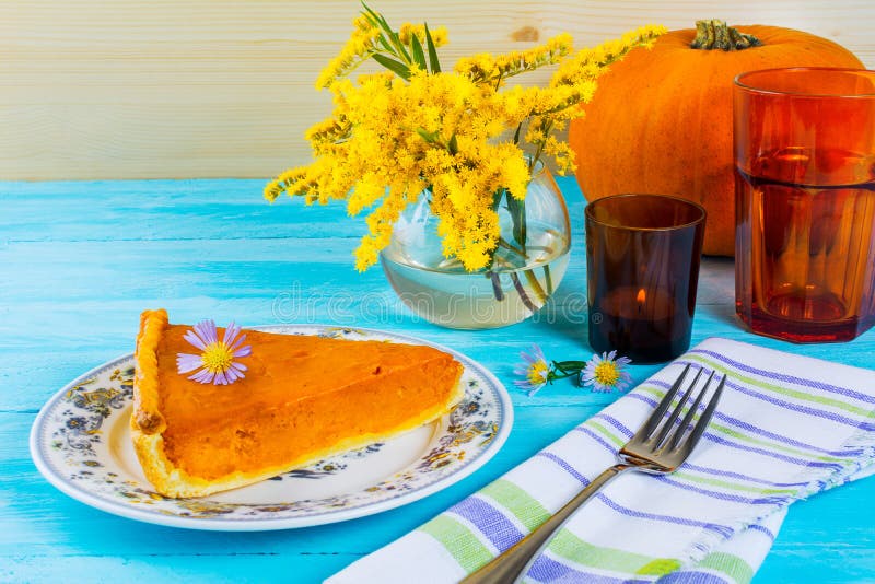 Thanksgiving Pumpkin Pie Slice on the Blue Wooden Table Stock Image ...