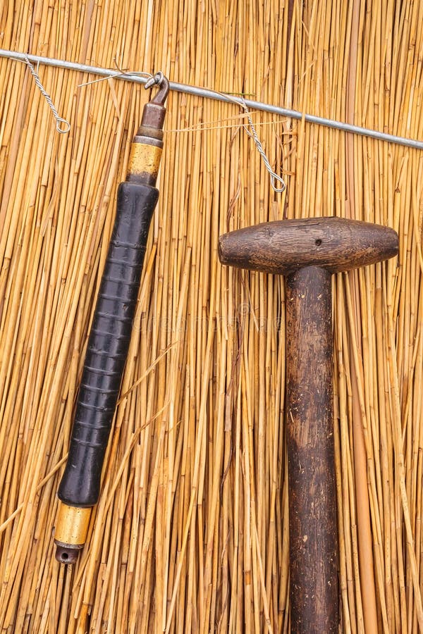Thatch Tools in Front of a Newly Thatched Roof Stock Image - Image of ...