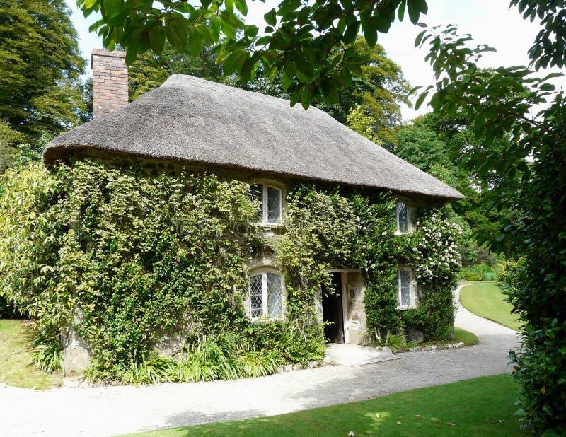 Thatched gardeners cottage stock image. Image of england - 11260157