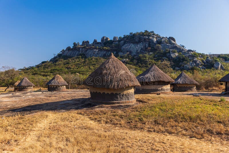 Traditional Huts in Front of Hill Complex - Great Zimbabwe Stock Image ...
