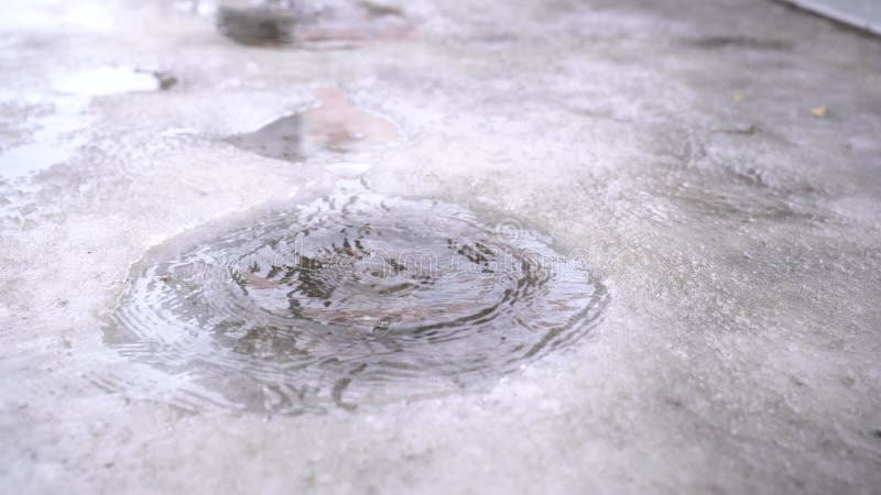 Thaw. a Puddle of Water in Ice As a Result of Falling Drops of Melt ...