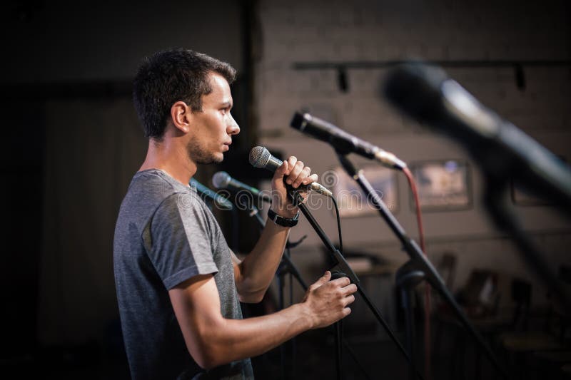 Sound Technician at Theatre Adjusting Sound Elements, Looking at Script ...