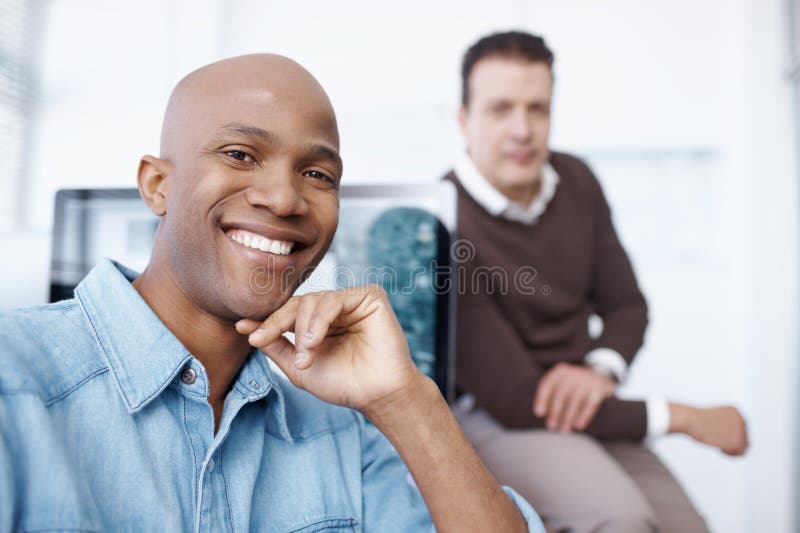 Their Office Environment Is Very Relaxed Portrait Of Two Coworkers