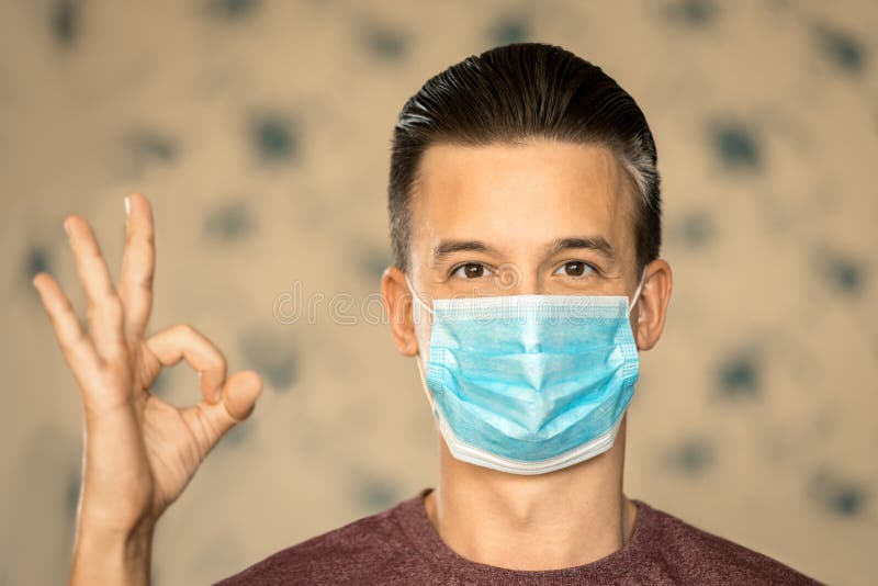 Theme of Coronavirus and Safety. a Young Man in a Blue Mask from a ...