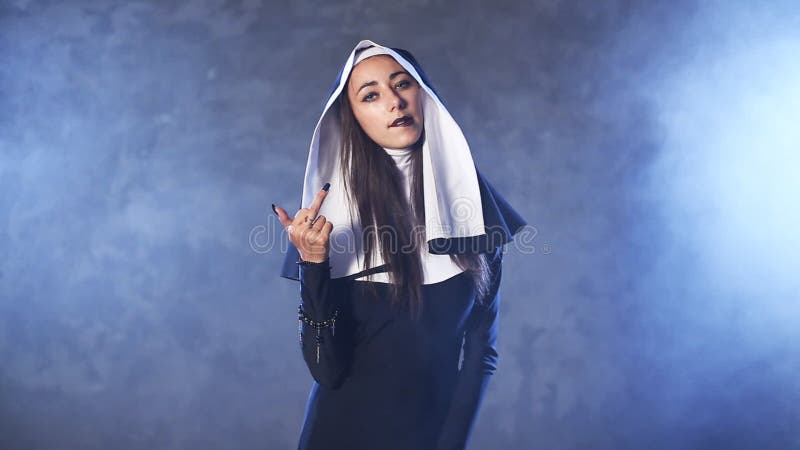 Nun Shows the Middle Finger of the Hand Stock Footage - Video of church ...