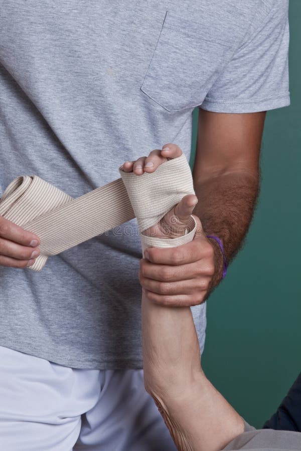 Applying a bandage for leg stock image. Image of injury - 3283839