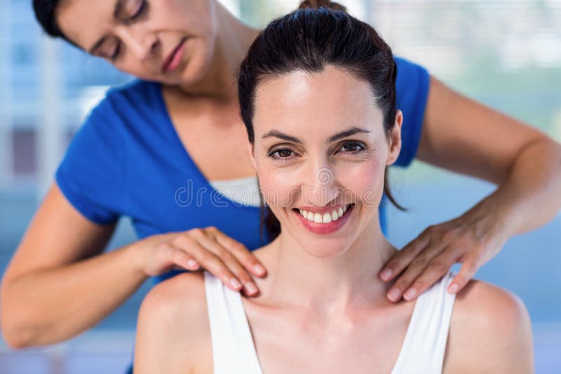 Therapist Doing Back Massage To Her Patient Stock Photo - Image of neck ...