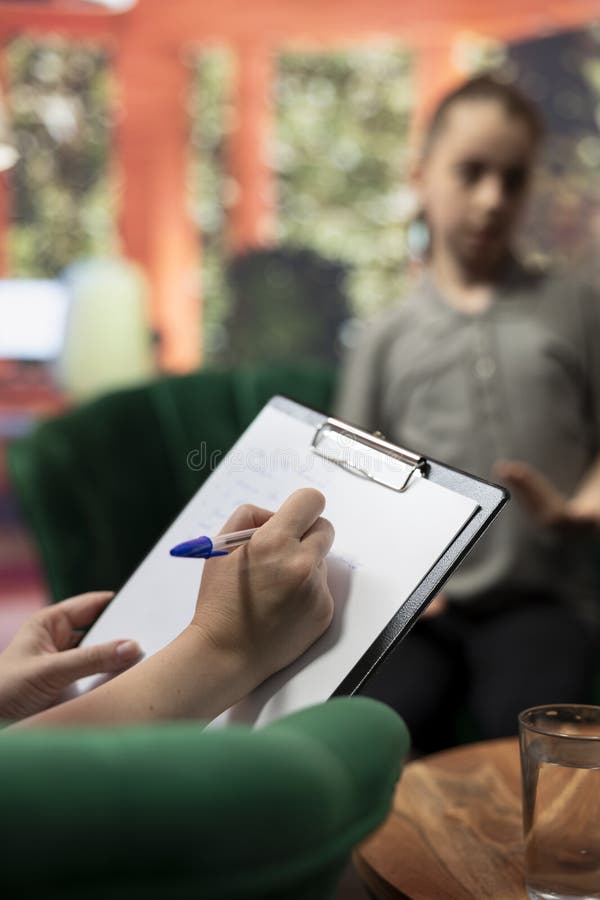Therapist Expert Takes Notes of Behavioral and Mental Progress during ...