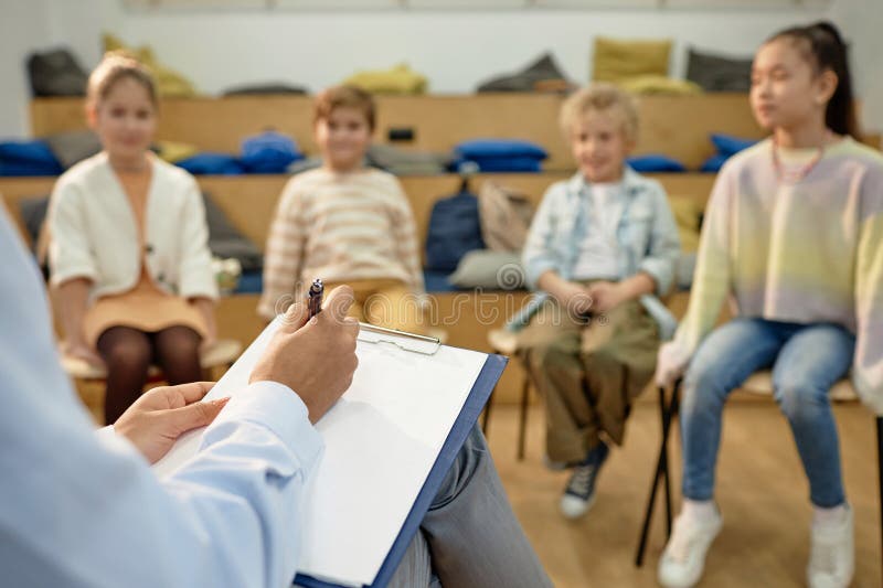 Therapist Holding Clipboard and Taking Notes Stock Photo - Image of ...