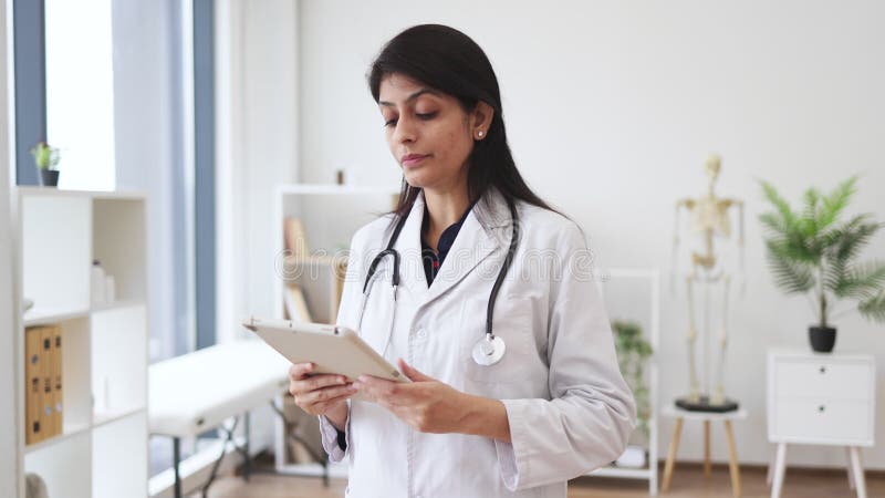 Therapist Holding Tablet while Posing in Doctor S Office Stock Video ...