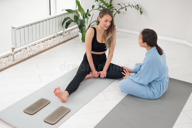 The Therapist Supports the Client after Standing on the Sadhu Boards ...