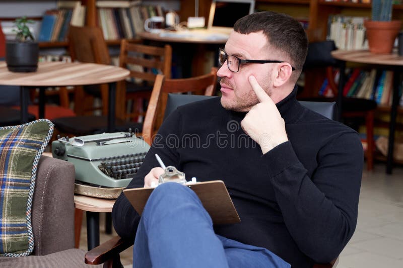 Therapist Writing Down Notes during Therapy Sitting in a Chair Stock ...
