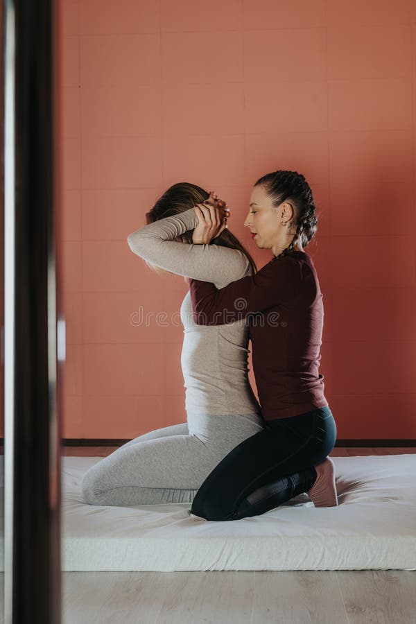 A Therapy Session Showcasing a Professional Assisting a Client with ...