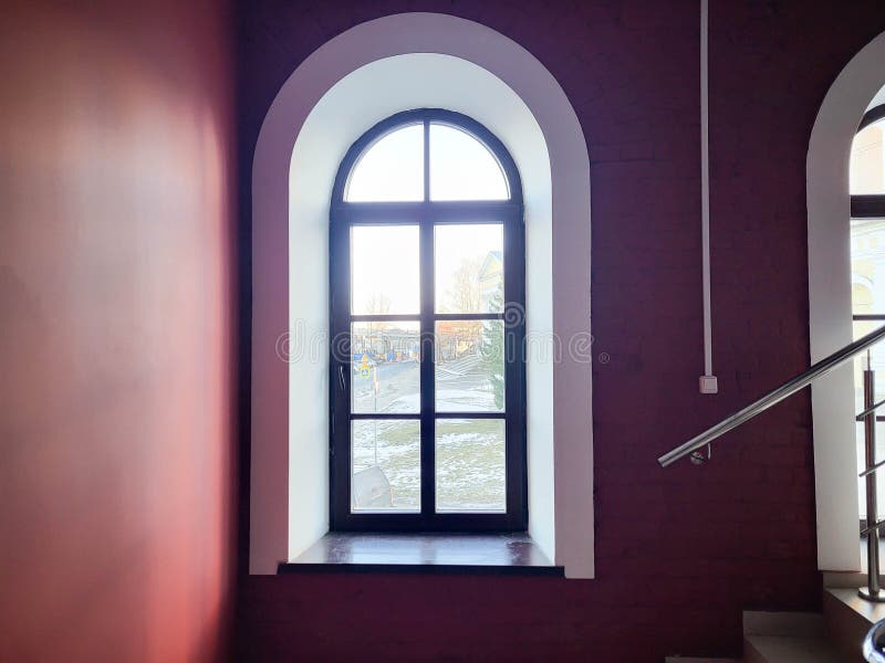 There is an Ancient Arched Window on the Red Wall of the Landing Stock ...