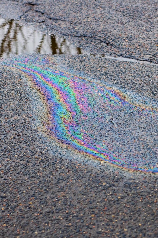 There is a Beautiful Rainbow Reflected in the Water on the Ground Stock ...