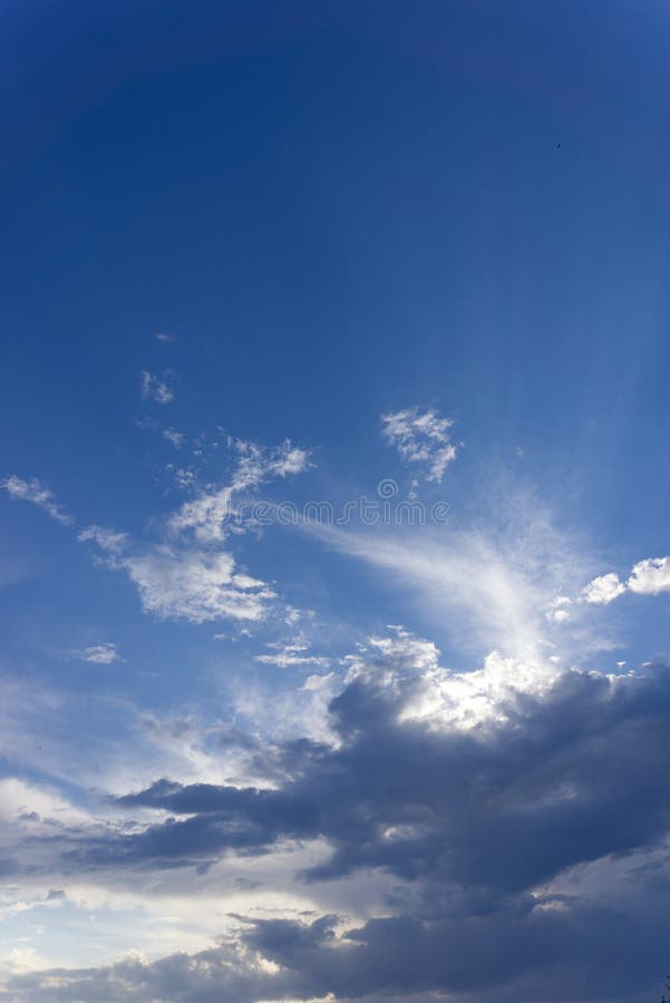 There are Beautiful White Clouds in the Blue Sky. Vertical Snapshot ...
