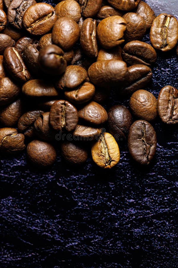 There are Blue Colored Coffee Beans Scattered on a Blue Colored Table ...