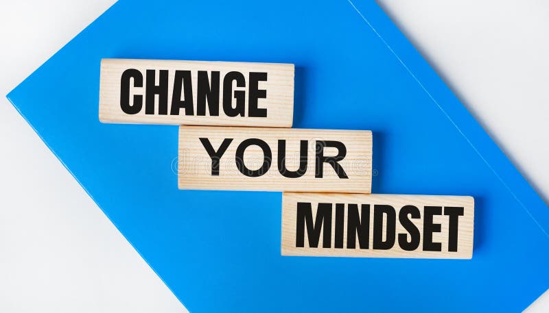 There is a Blue Notebook on a Light Gray Background. Above are Three ...