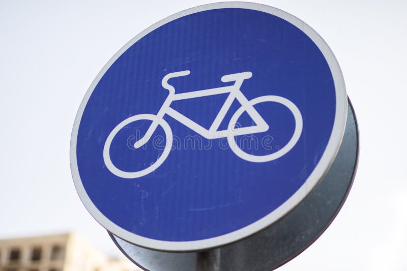There is a Blue Sign Displaying a White Bicycle Symbol on it Stock ...