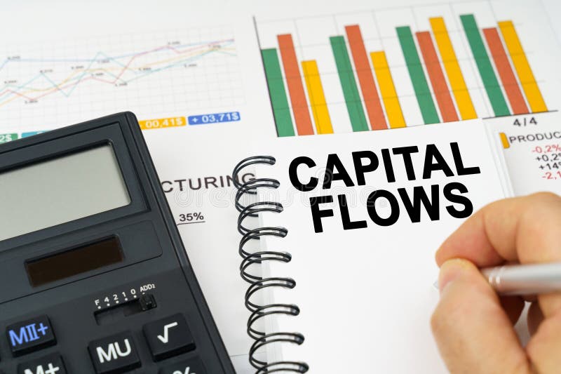 On the Table are Business Charts, Office Supplies and a Notepad with ...