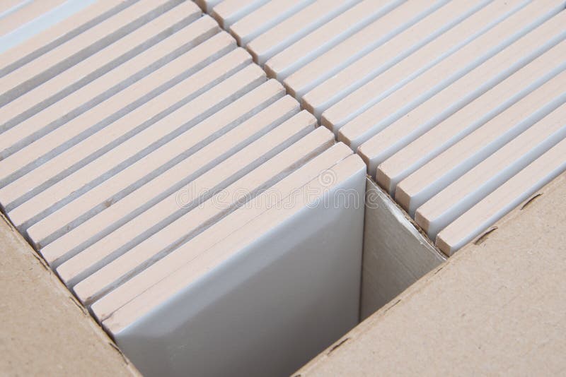 There is a Ceramic Tile in a Cardboard Box, Folded in a Row, Close-up ...