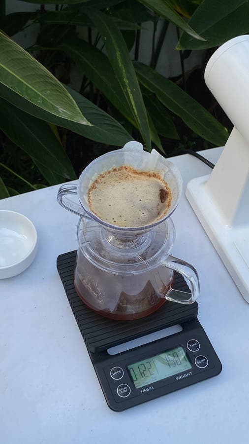 There is a Coffee Pot on a Scale with a Cup of Coffee Stock Image ...