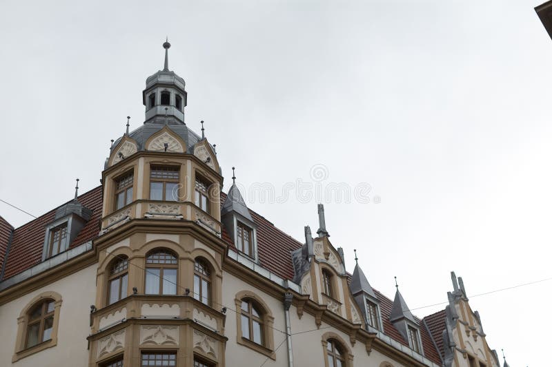 There Exists a Large Notable Building that Features a Tower on Its Top ...