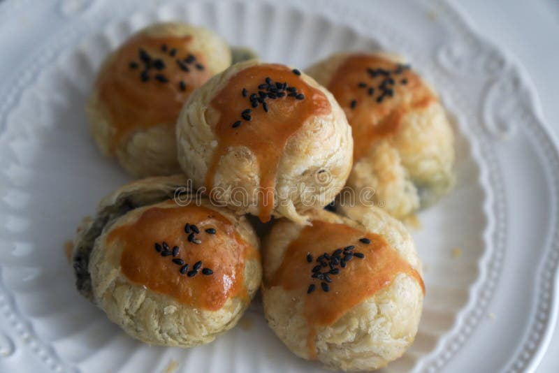 There are Five Egg Yolk Pastries with Bean Paste on the Plate Stock ...