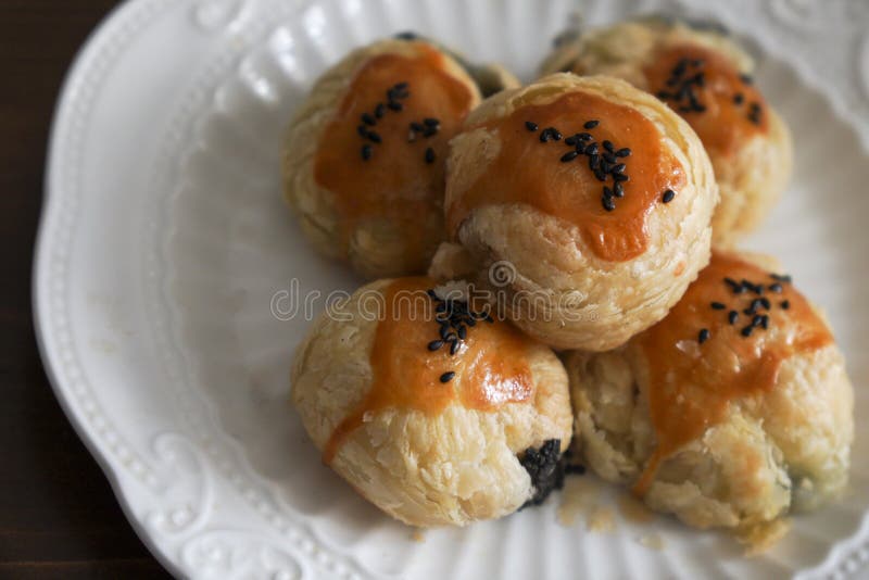 There are Five Egg Yolk Pastries with Bean Paste on the Plate Stock ...