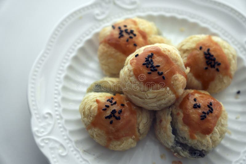 There are Five Egg Yolk Pastries with Bean Paste on the Plate Stock ...
