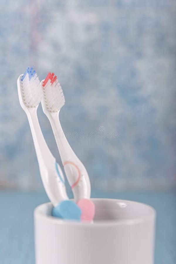 There is a Heart Pattern on the Toothbrush Handle. Two Toothbrushes in ...