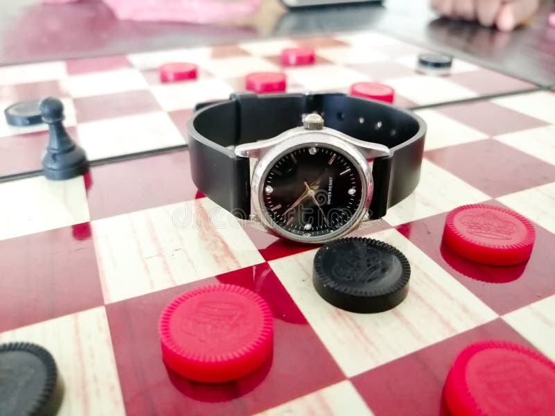 There is a Ladies Wrist Watch on the Chess Board Stock Image - Image of ...