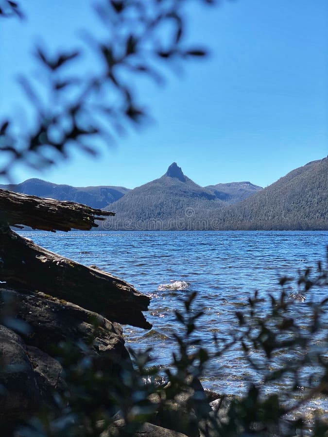 There is a Lake and Mountain Range Near the Ocean and Trees Stock Image ...