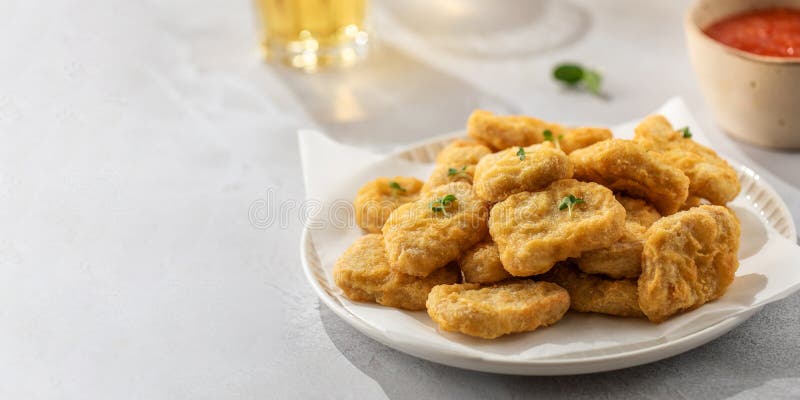 There is a Plate of Crispy Chicken Nuggets on the Table. Fast Food ...